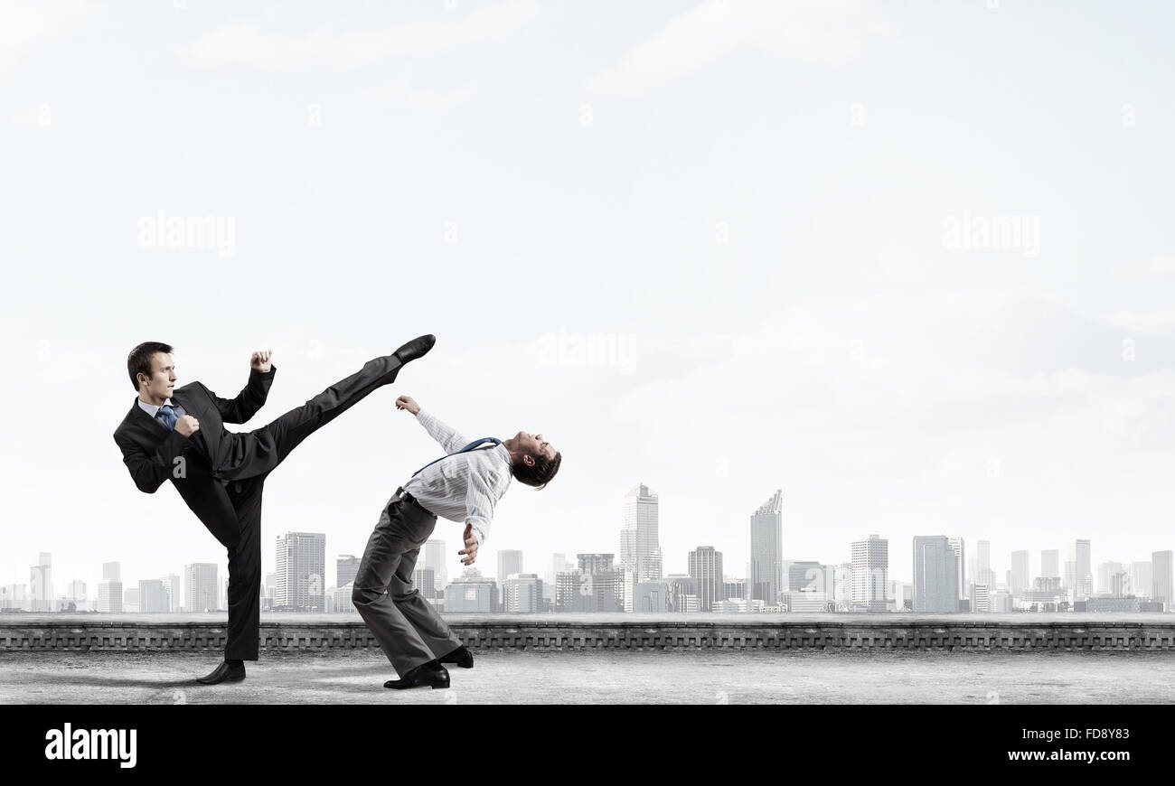 Business colleagues fighting other hi-res stock photography and images ...
