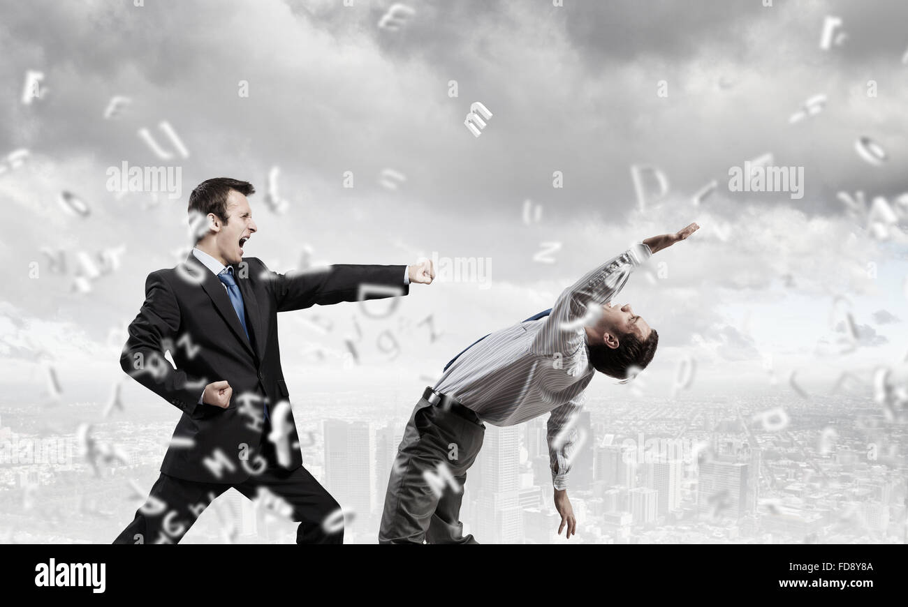 Two businesspeople in anger fighting with each other Stock Photo - Alamy