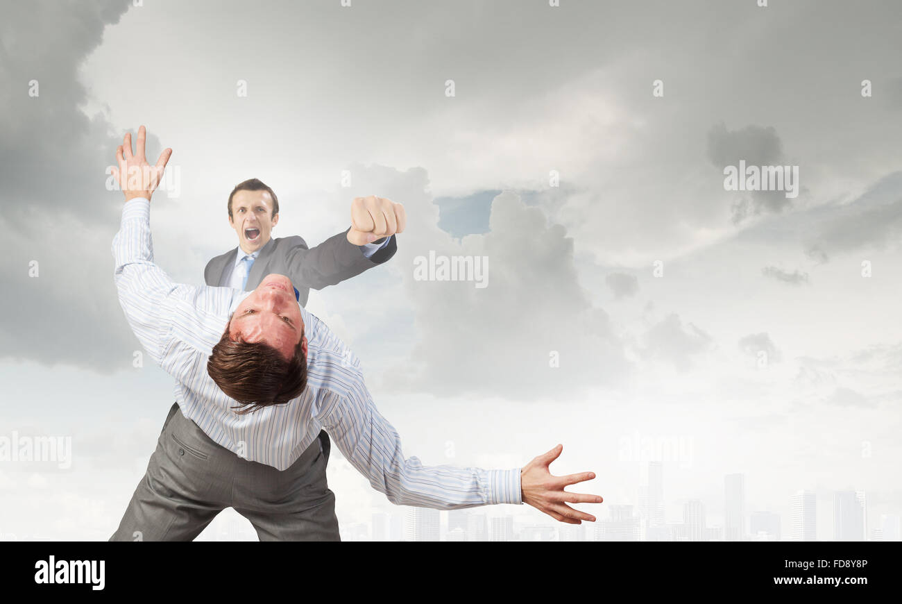 Two businesspeople in anger fighting with each other Stock Photo - Alamy