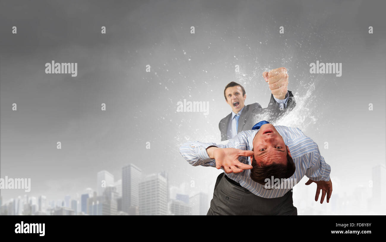 Two businesspeople in anger fighting with each other Stock Photo - Alamy