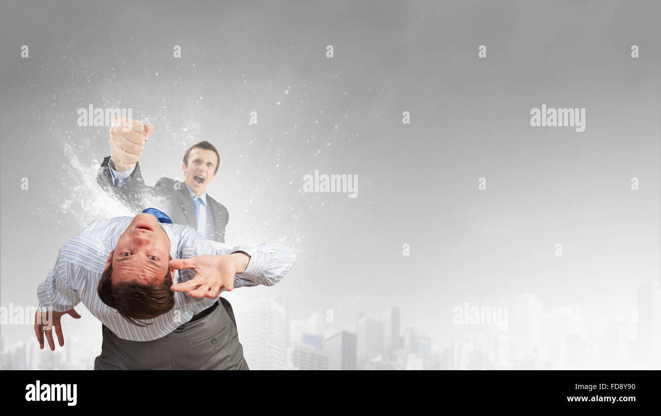 Two businesspeople in anger fighting with each other Stock Photo - Alamy
