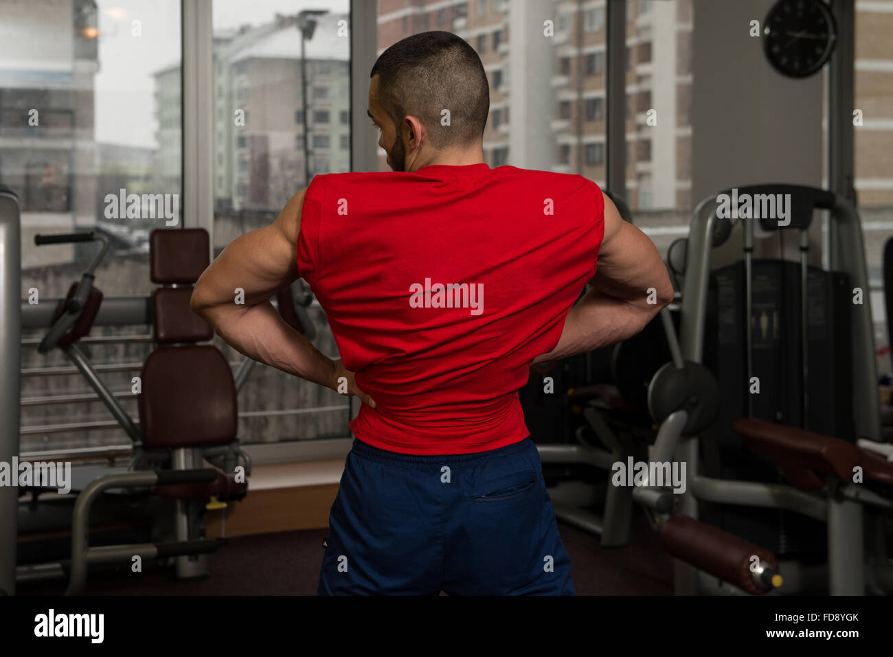 Bodybuilder Flexing Muscles In T-Shirt Stock Photo - Alamy