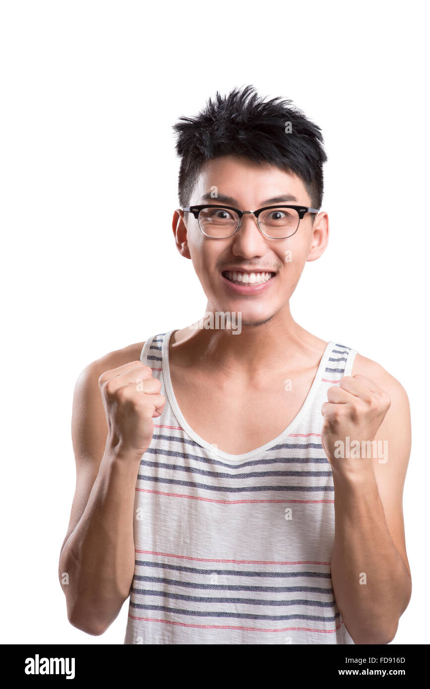 Portrait of young man cheering Stock Photo - Alamy