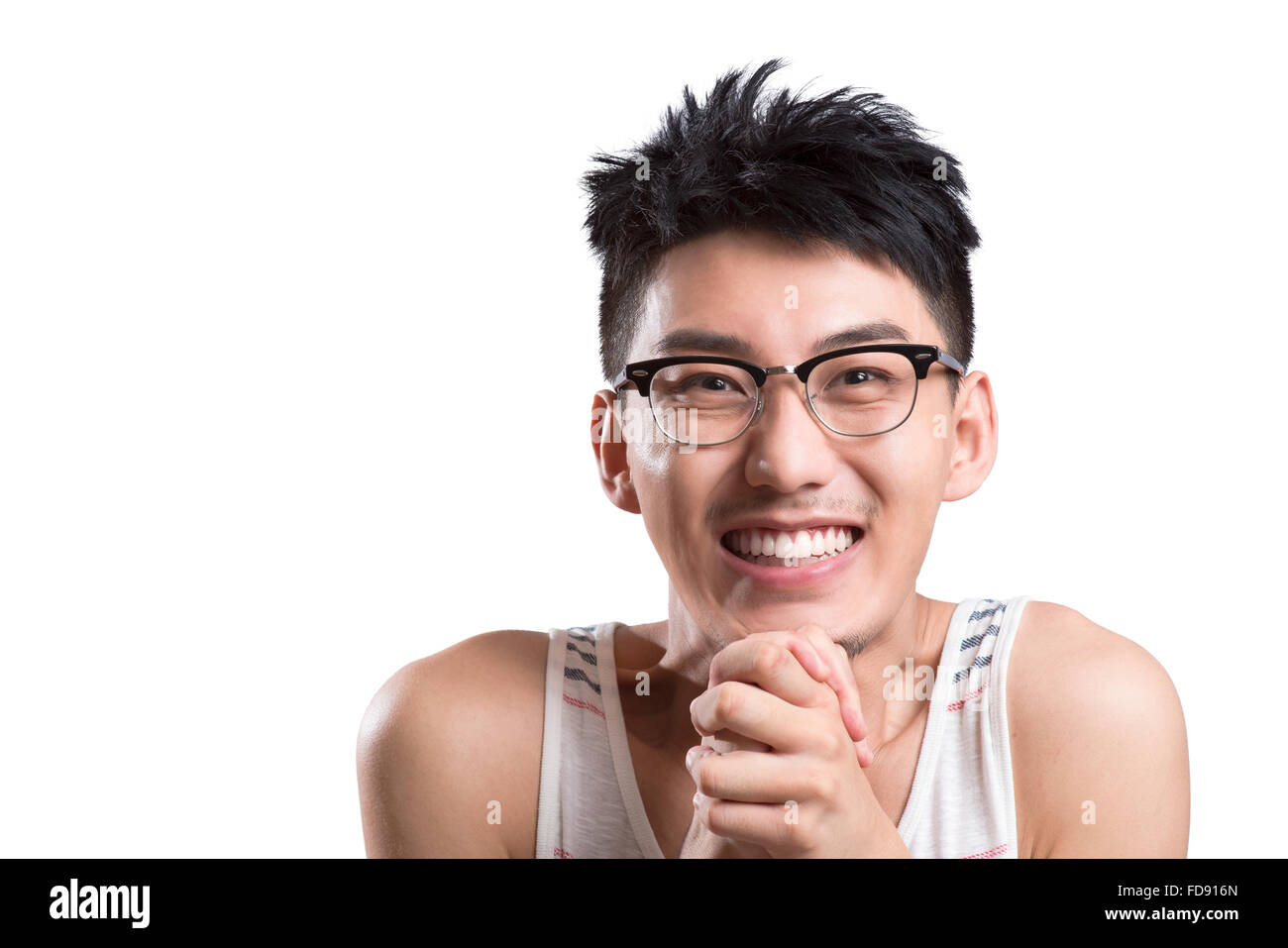 Portrait of young man praying Stock Photo - Alamy