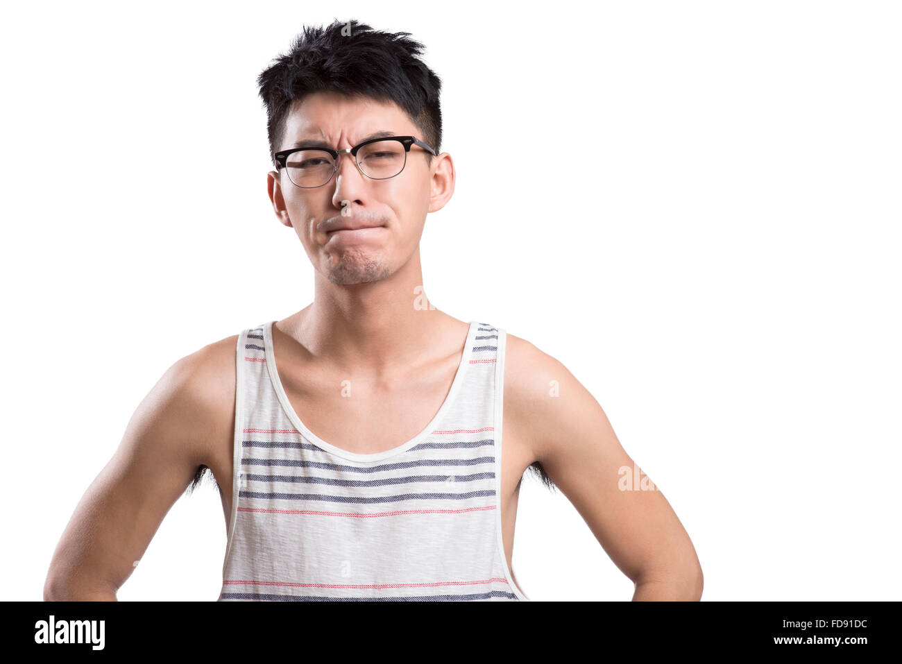 Portrait of young man sulking Stock Photo - Alamy