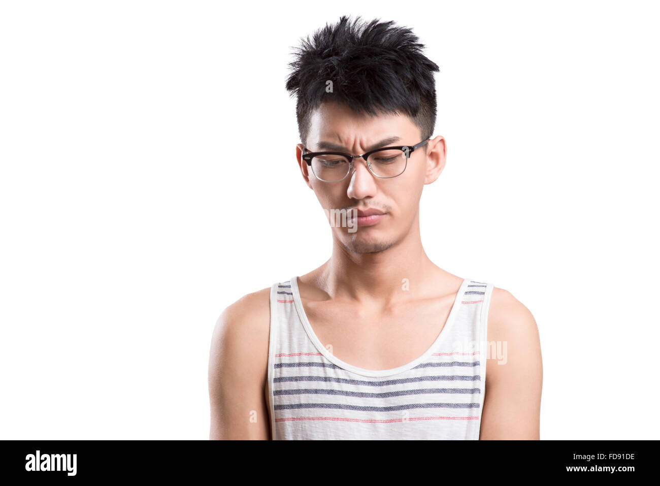 Portrait of young man displeased Stock Photo - Alamy