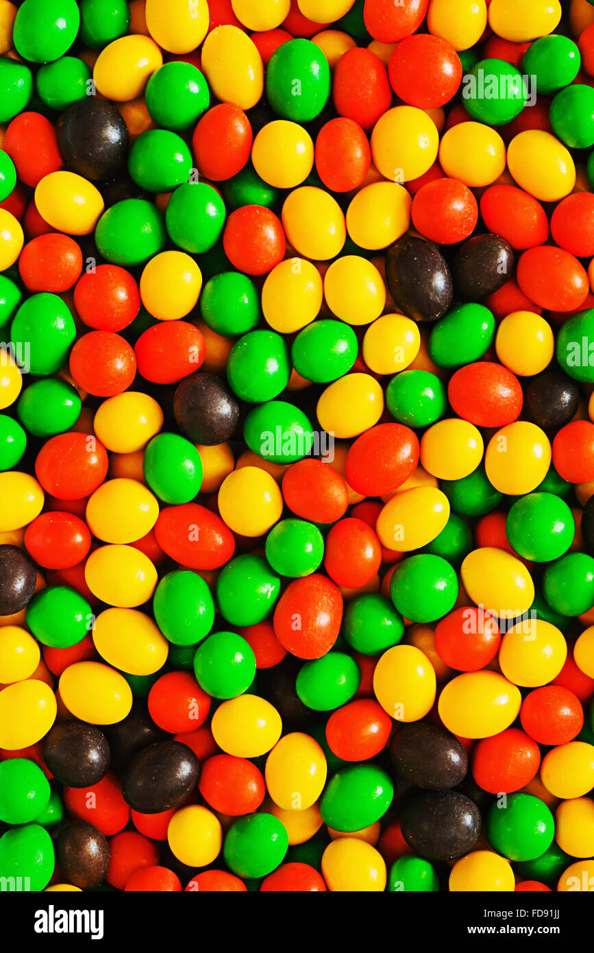 Assorted sweet jelly beans. Pile of colorful chocolate coated candy ...