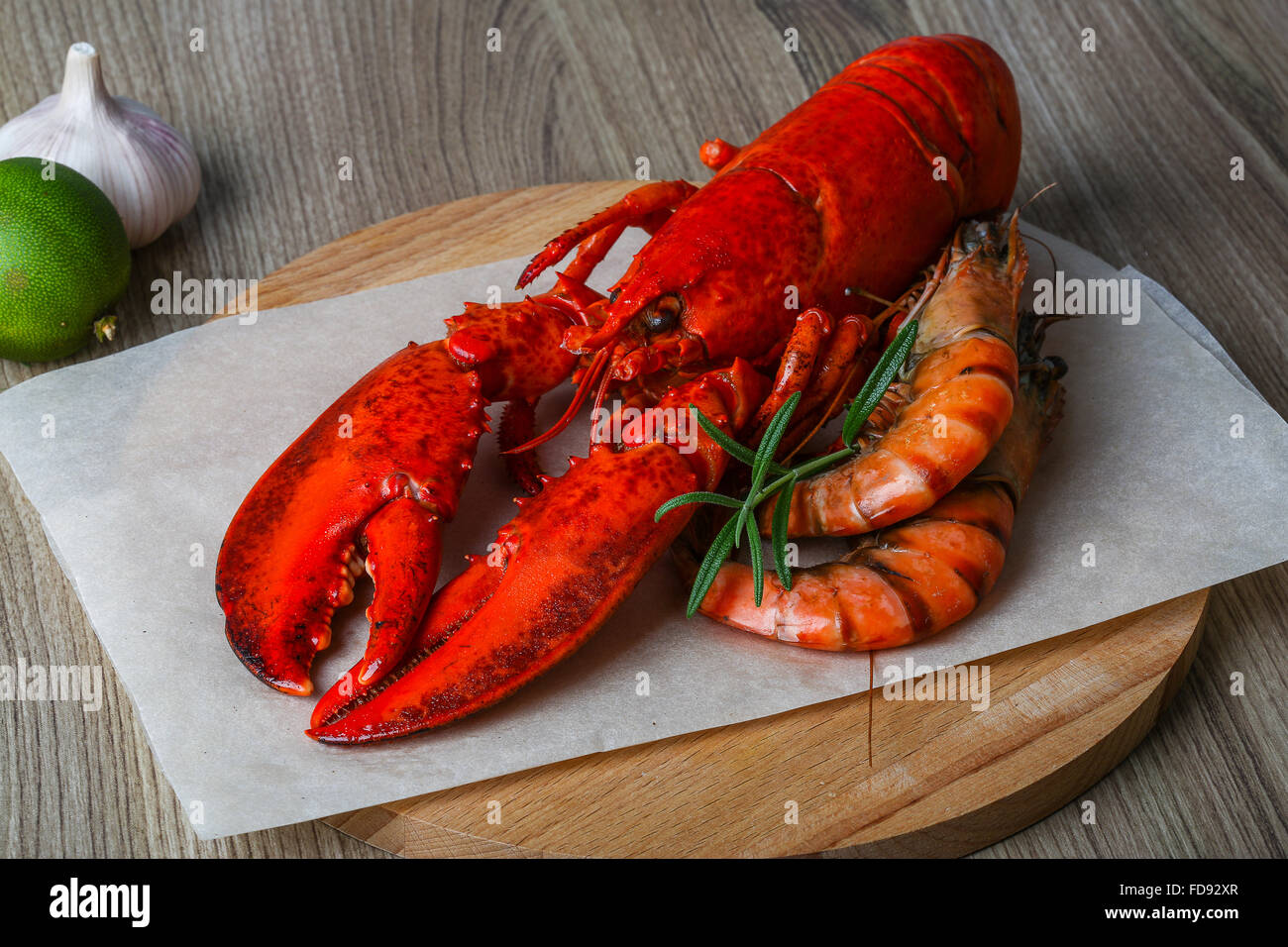 Big cooked lobster and tiger shrimps ready for eating Stock Photo - Alamy