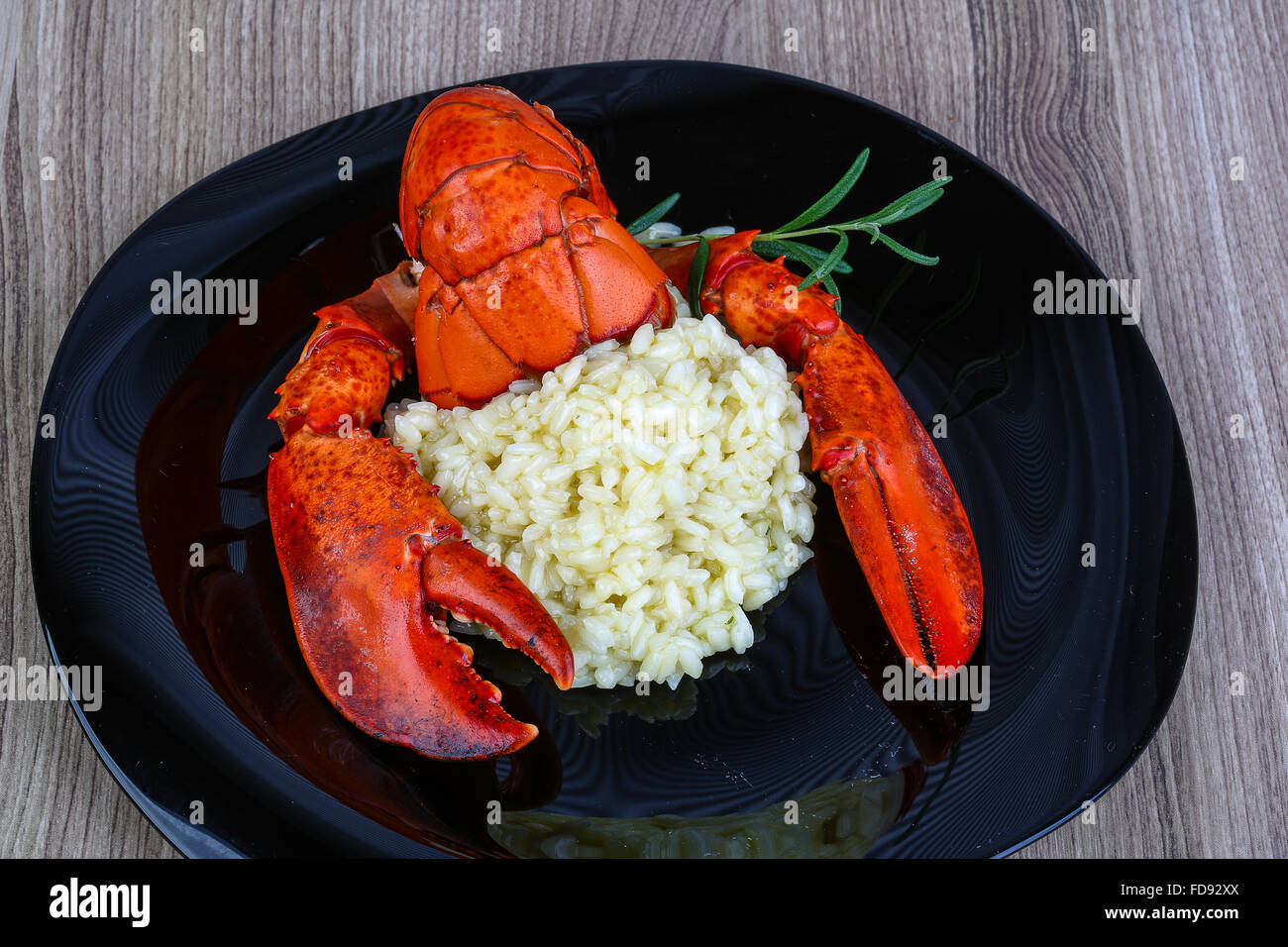 Delicous Risotto with lobster served rosemary and parmesan Stock Photo ...