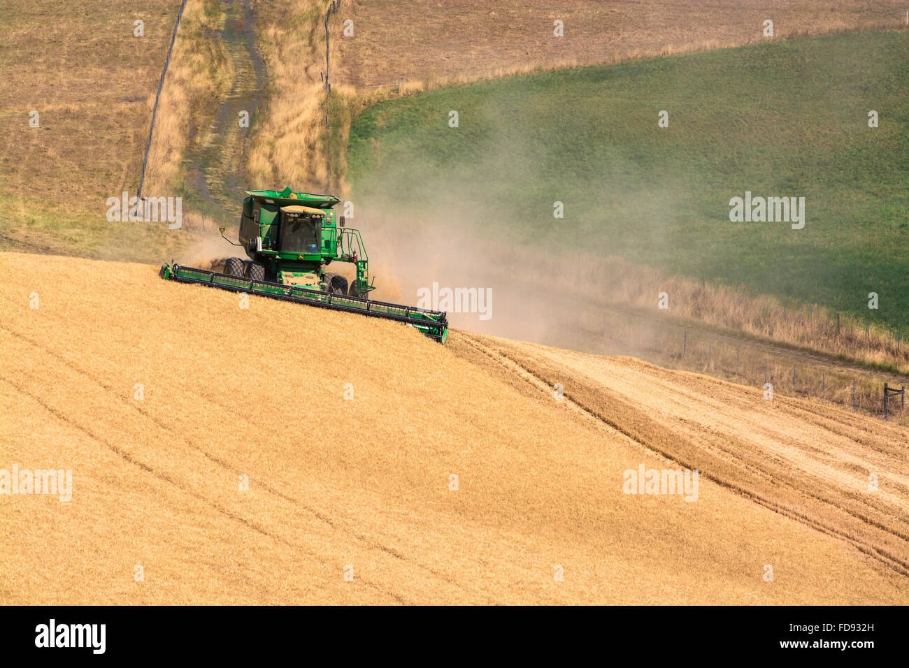 John Deere combines harvesting wheat in the Palouse region of Eastern ...