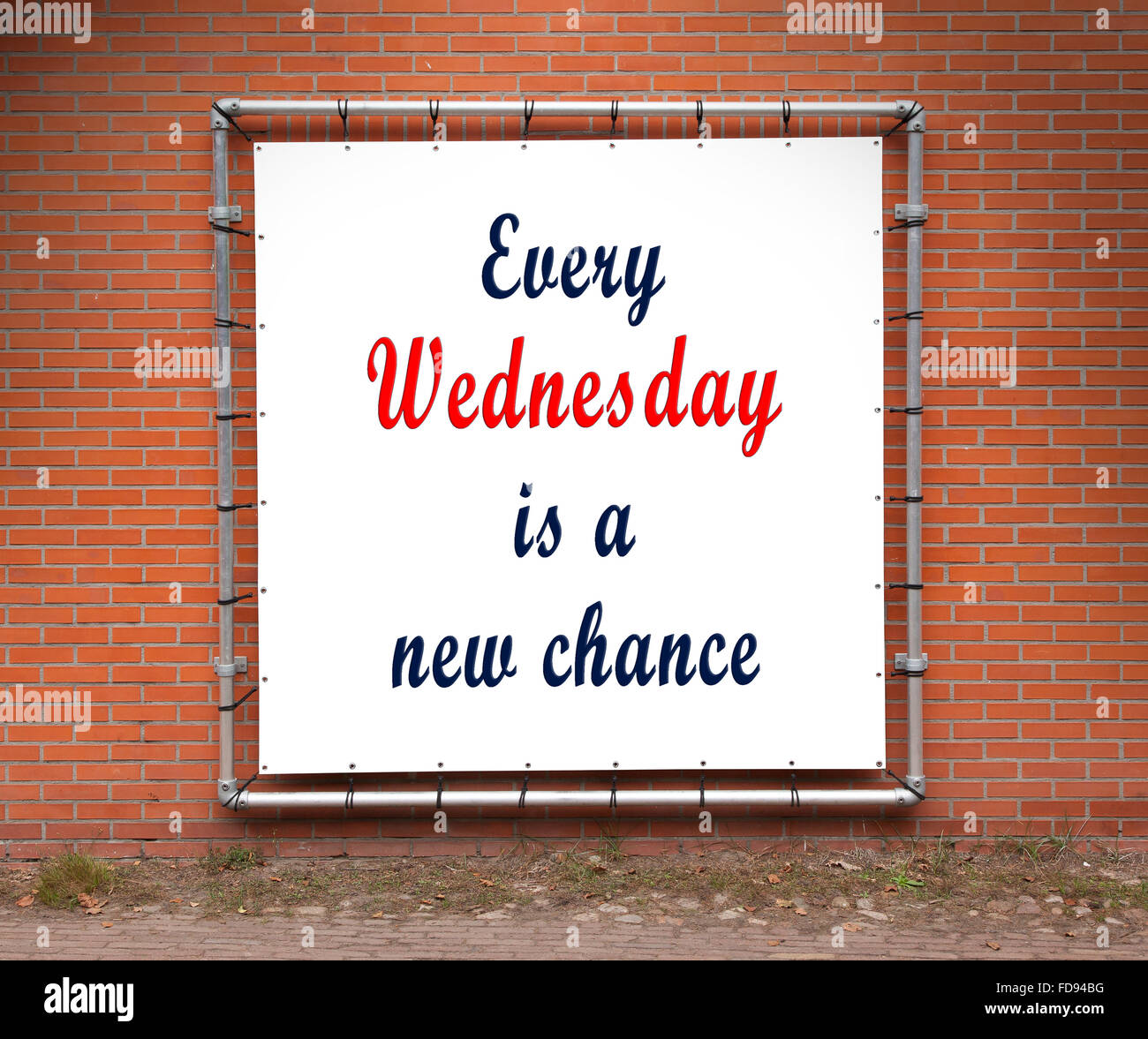 Large banner with inspirational quote on a brick wall - Every wednesday ...