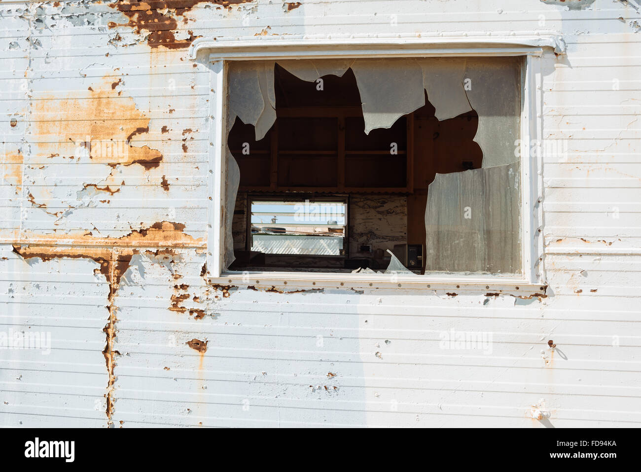 A broken window of an abandoned home in Bombay Beach, California, on ...