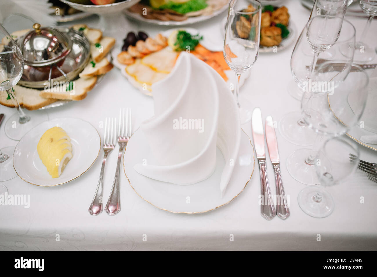 Banquet wedding table setting with plate, spoon, fork and knife Stock ...