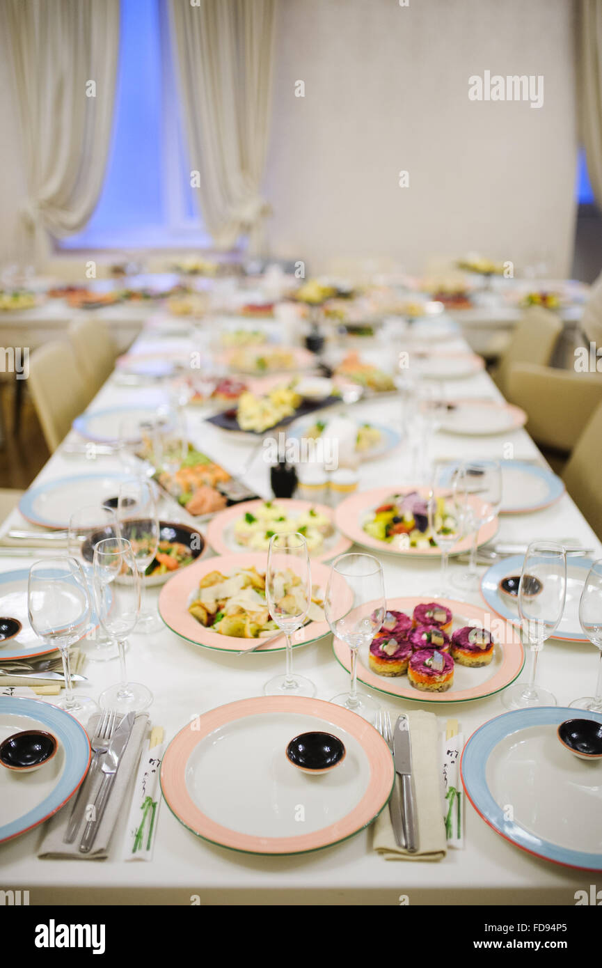 Banquet wedding table setting on evening reception awaiting guests ...