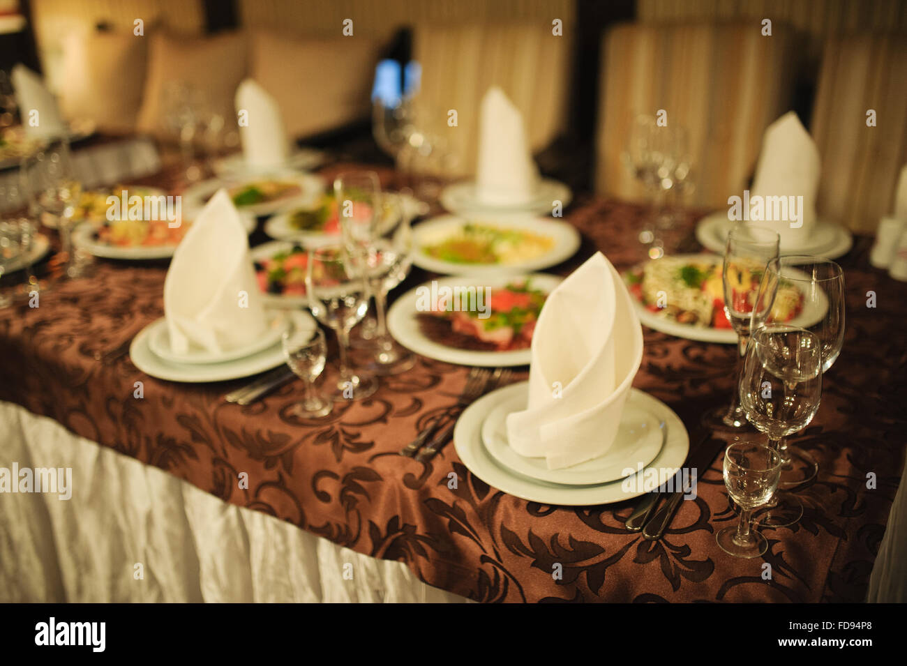 Banquet wedding table setting on evening reception awaiting guests ...