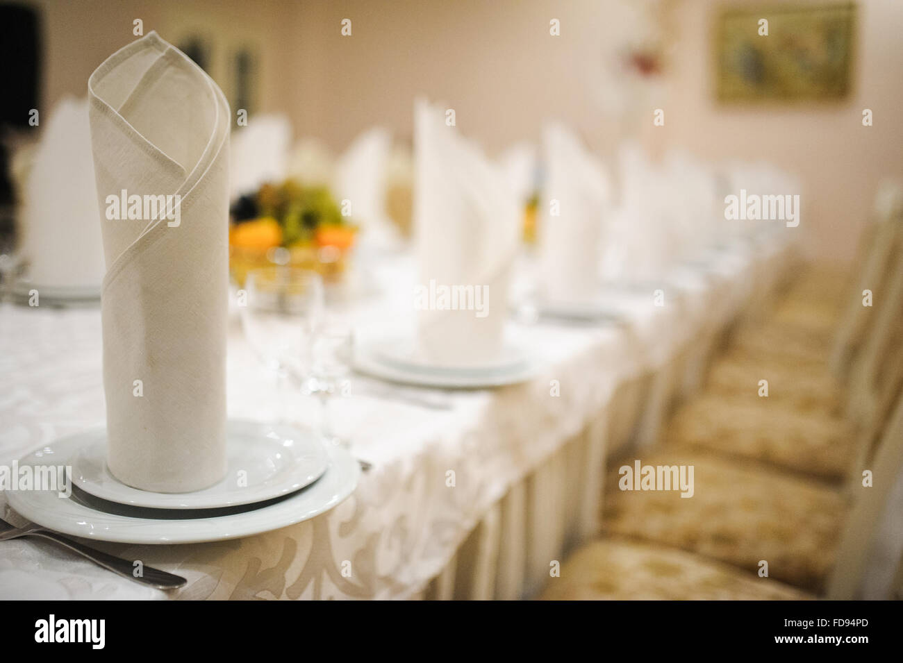 Banquet wedding table setting on evening reception awaiting guests ...