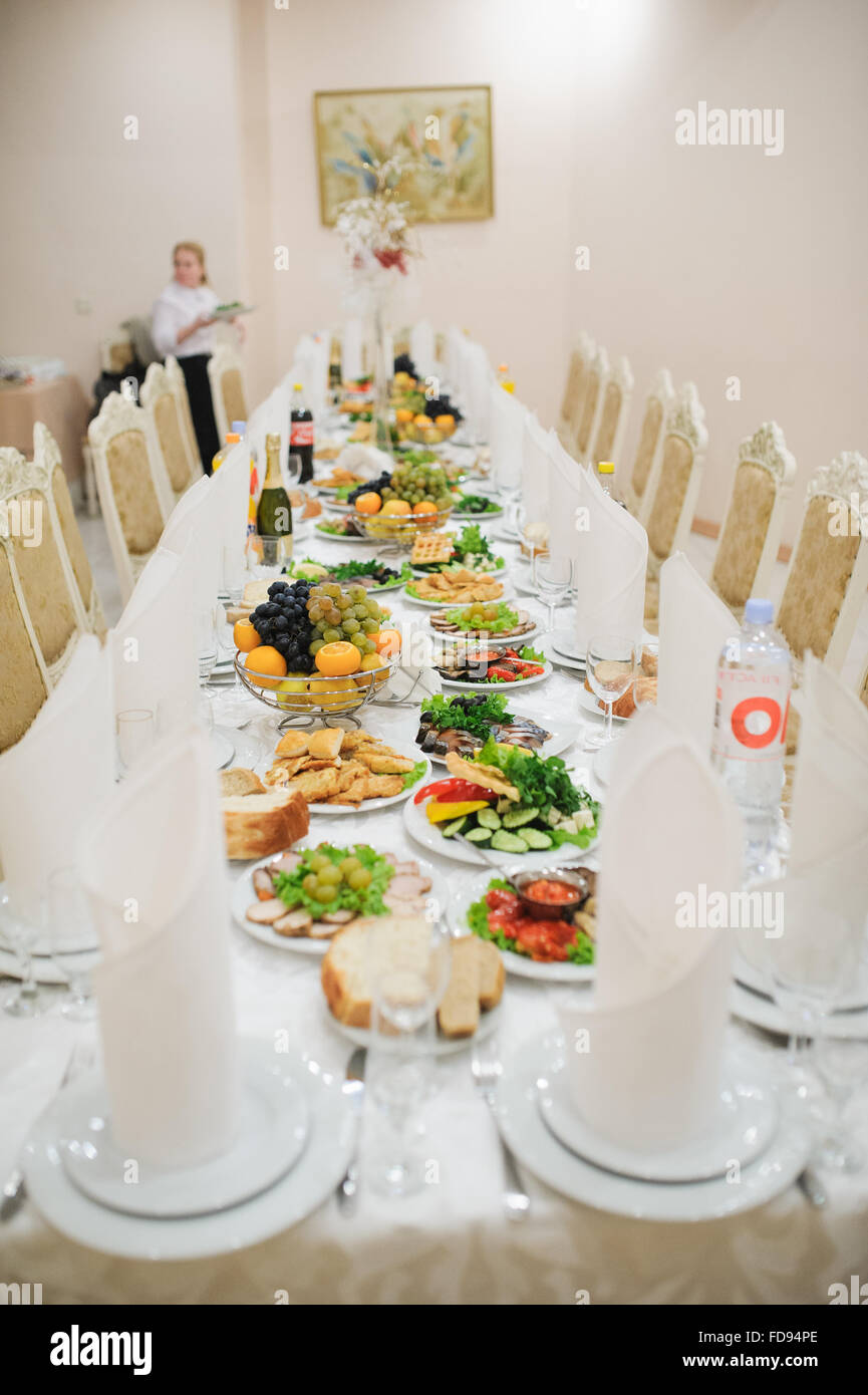 Banquet wedding table setting on evening reception awaiting guests ...
