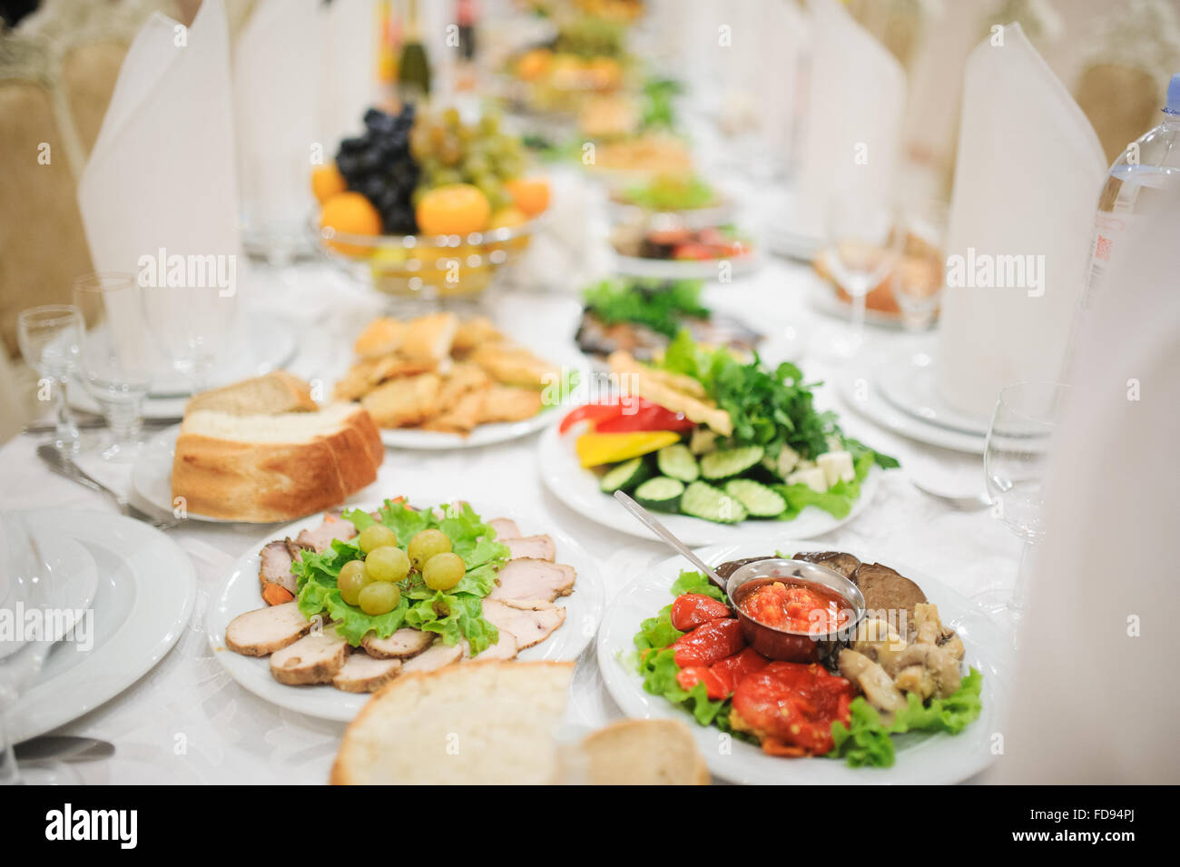Banquet wedding table setting on evening reception awaiting guests ...