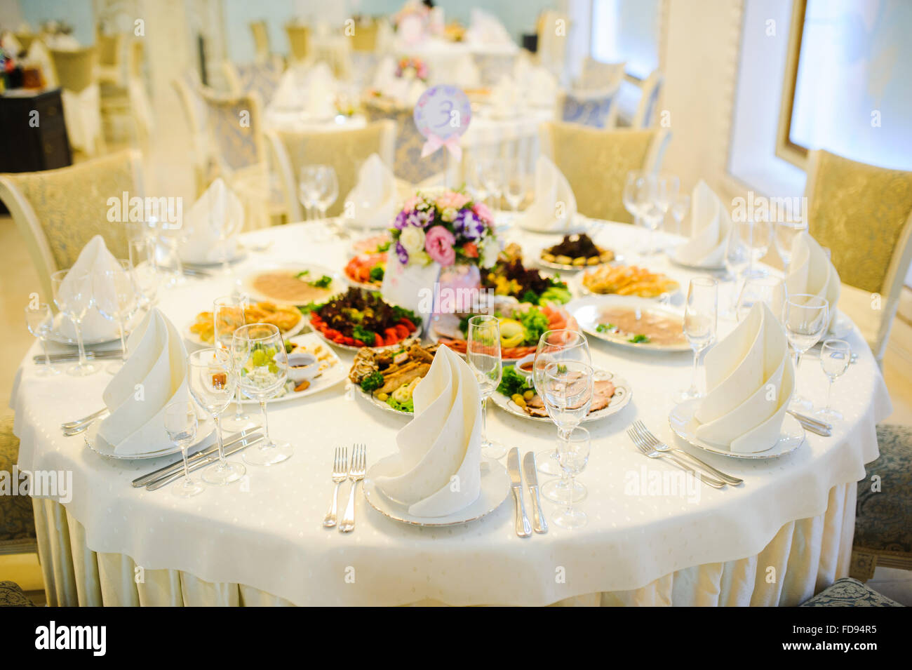Banquet wedding table setting on evening reception awaiting guests ...
