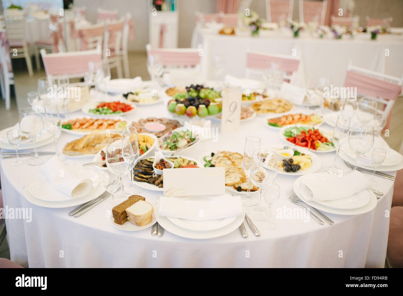 Banquet wedding table setting on evening reception awaiting guests ...