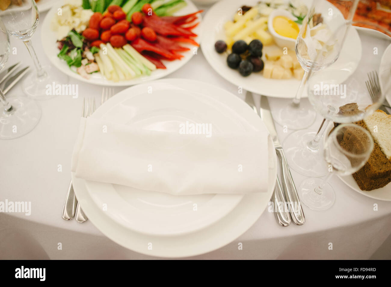 Banquet wedding table setting with plate, spoon, fork and knife Stock ...