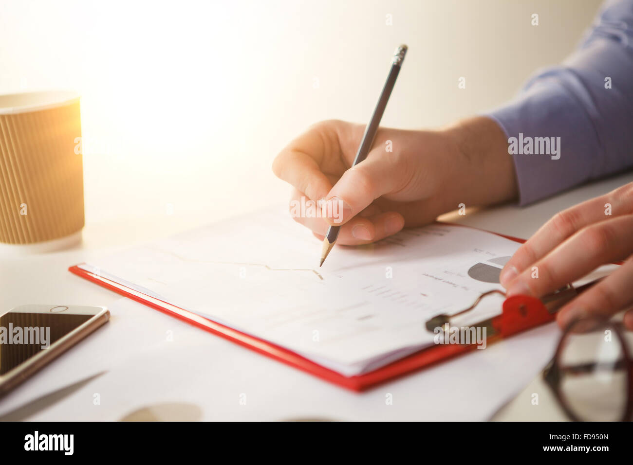 The male hand drawing a graph of growth Stock Photo - Alamy