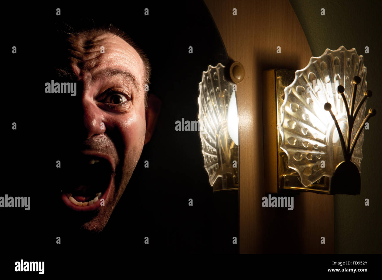 the face of a screaming man in the mirror Stock Photo - Alamy