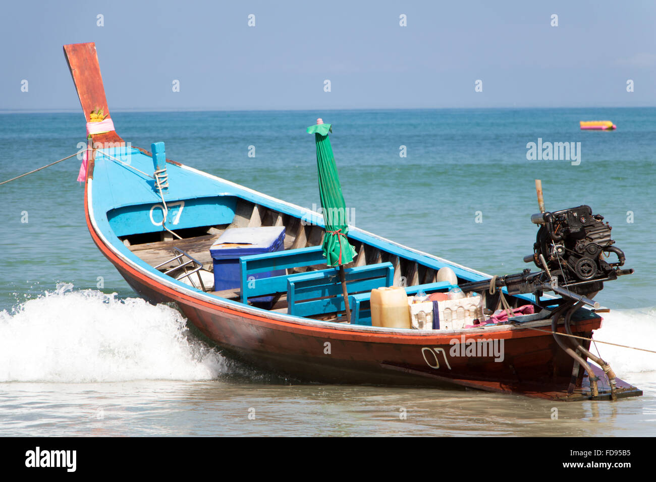 Empty boat in the waves on the sea Stock Photo - Alamy