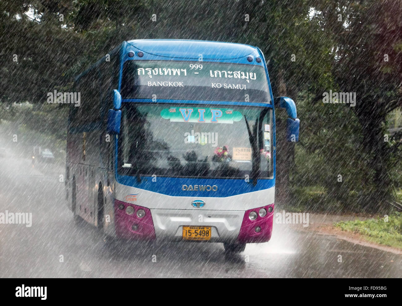 bus goes down the road in heavy rain Stock Photo - Alamy