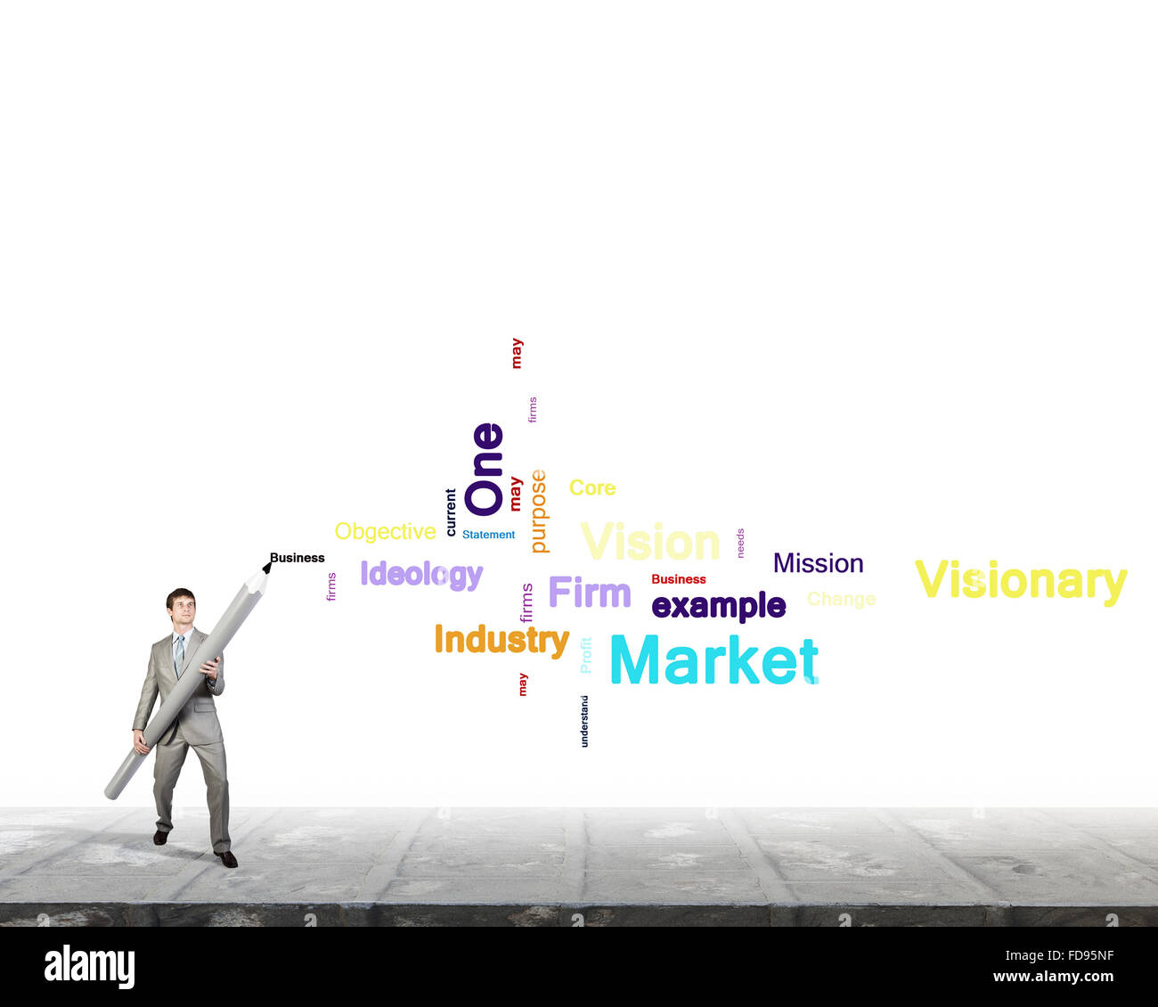 Young businessman writing business words with huge pencil Stock Photo ...