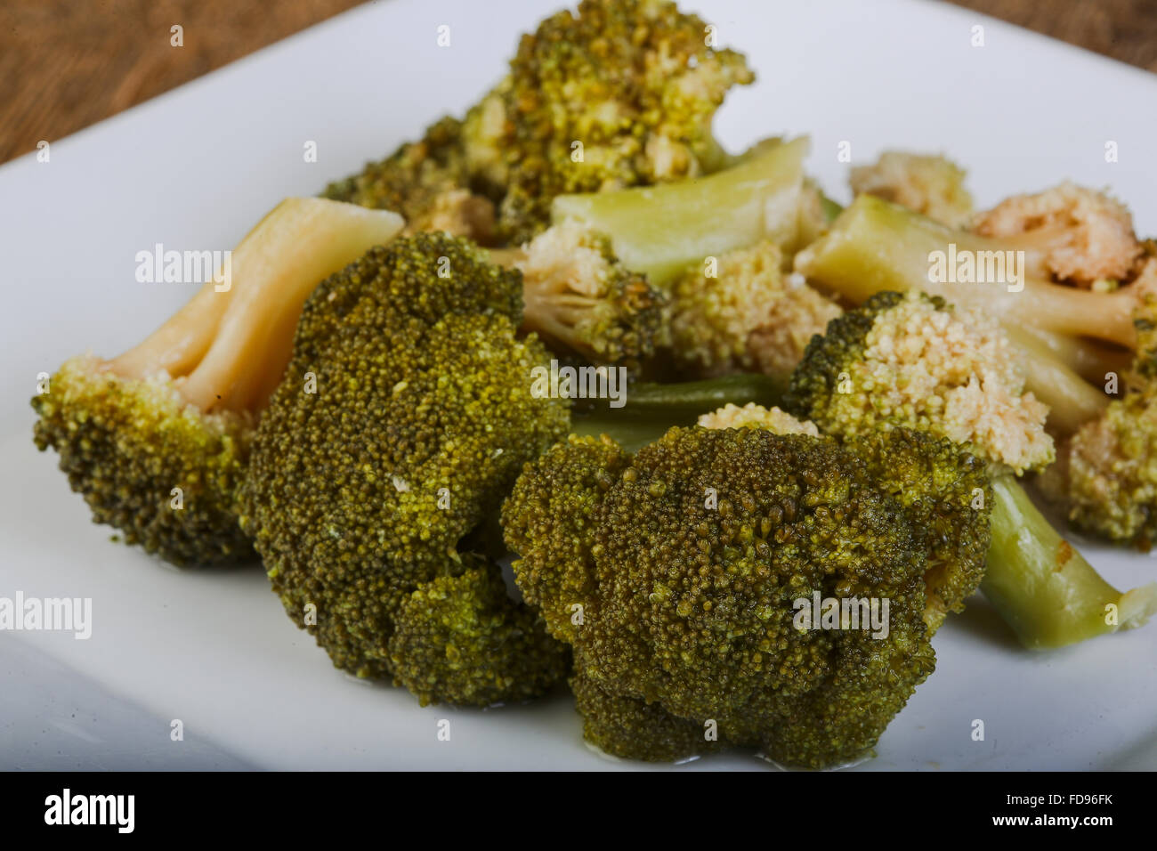 Green boiled caulliflower in the white plate Stock Photo - Alamy