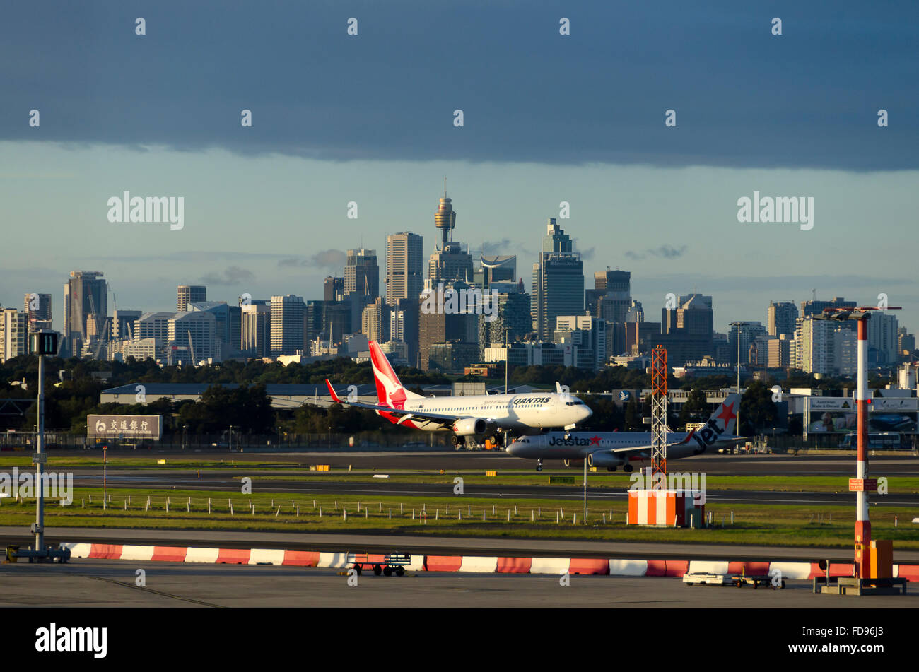 Qantas aircraft landing at Kingsford-Smith airport, CBD tower buildings ...