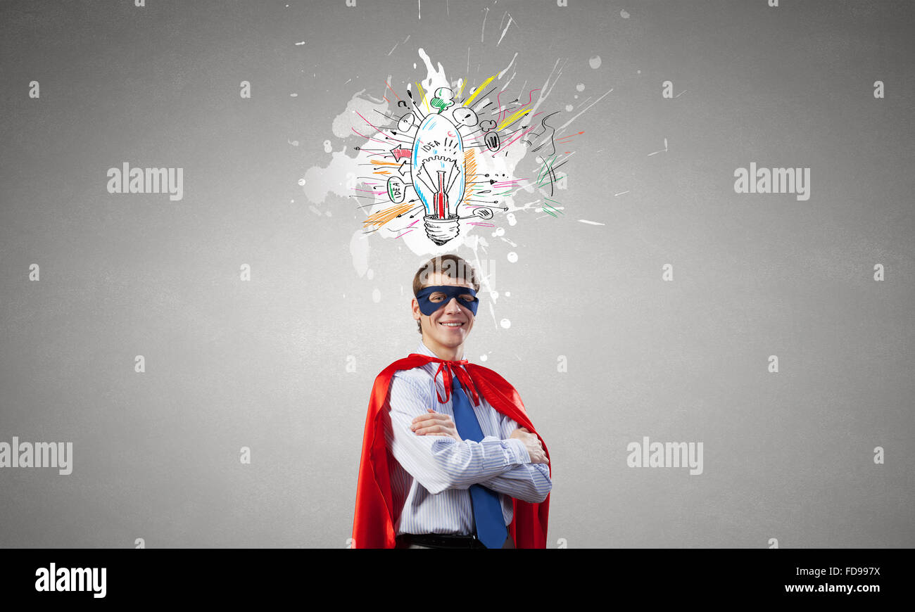 Young man in superhero costume representing power and courage hi-res ...