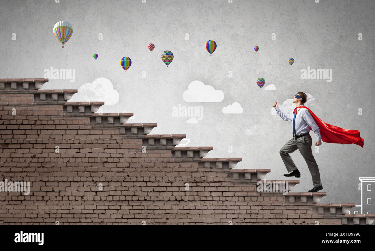 Young man in superhero costume representing creativity concept Stock ...