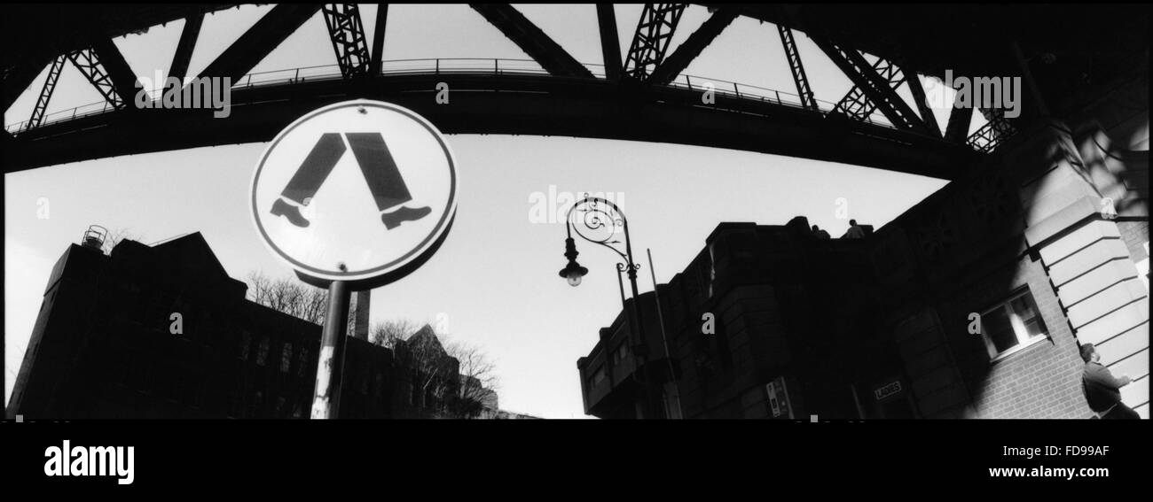 Pedestrian Crossing Sign Against Bridge On Street Stock Photo - Alamy