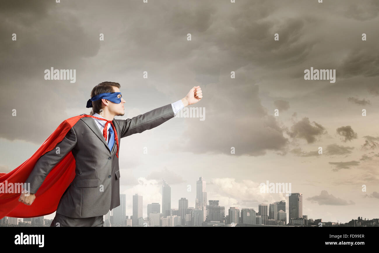 Young man in superhero costume representing power and courage Stock ...