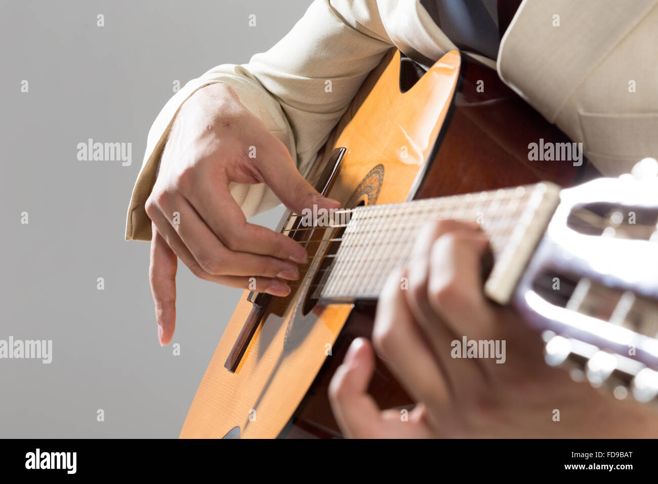 Close up of male hands playing acoustic guitar Stock Photo - Alamy