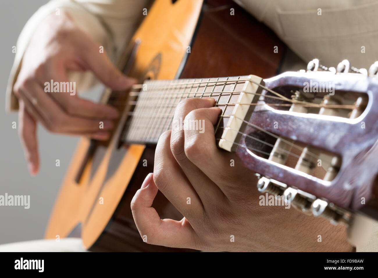 Close up of male hands playing acoustic guitar Stock Photo - Alamy
