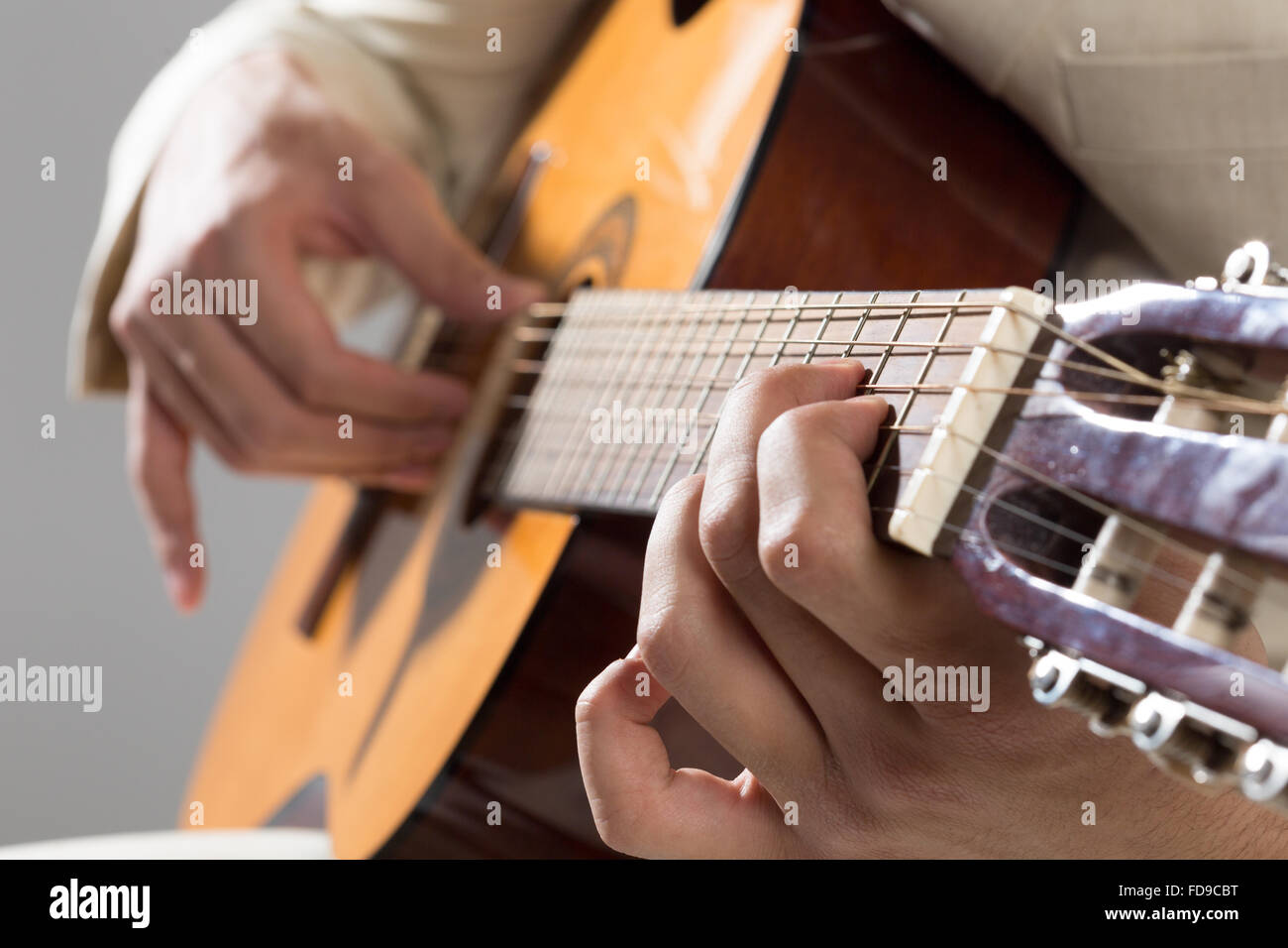 Close up of male hands playing acoustic guitar Stock Photo - Alamy