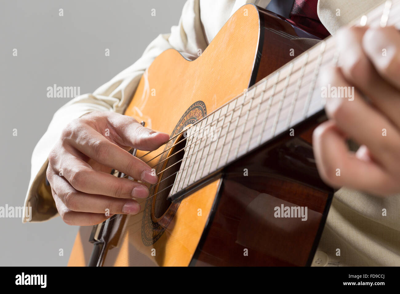 Close up of male hands playing acoustic guitar Stock Photo - Alamy