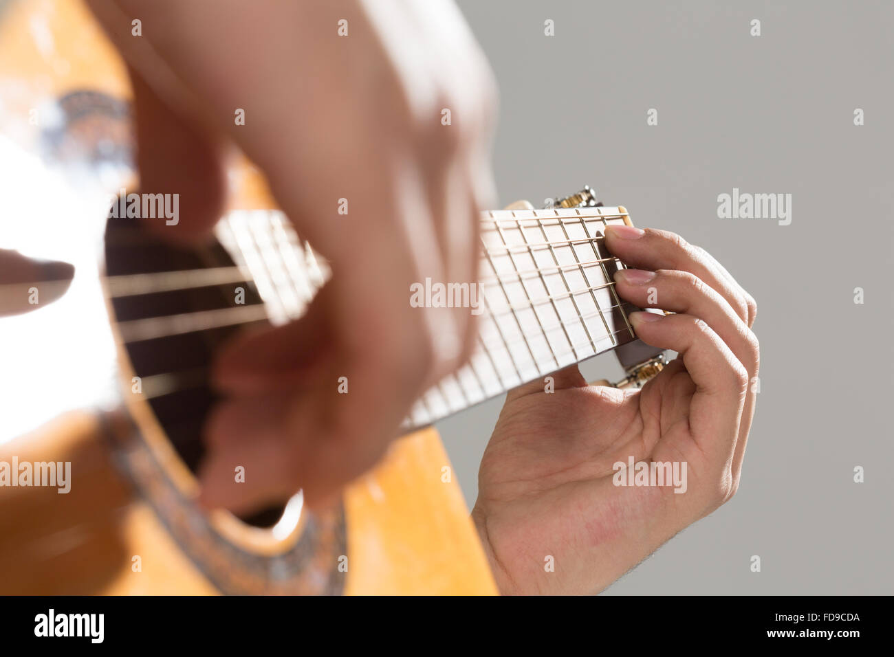 Close up of male hands playing acoustic guitar Stock Photo - Alamy