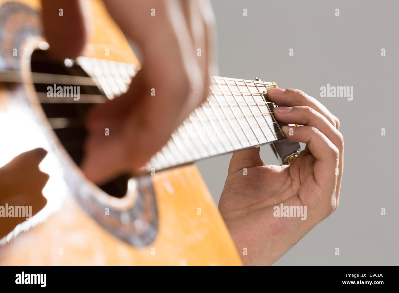 Close up of male hands playing acoustic guitar Stock Photo - Alamy