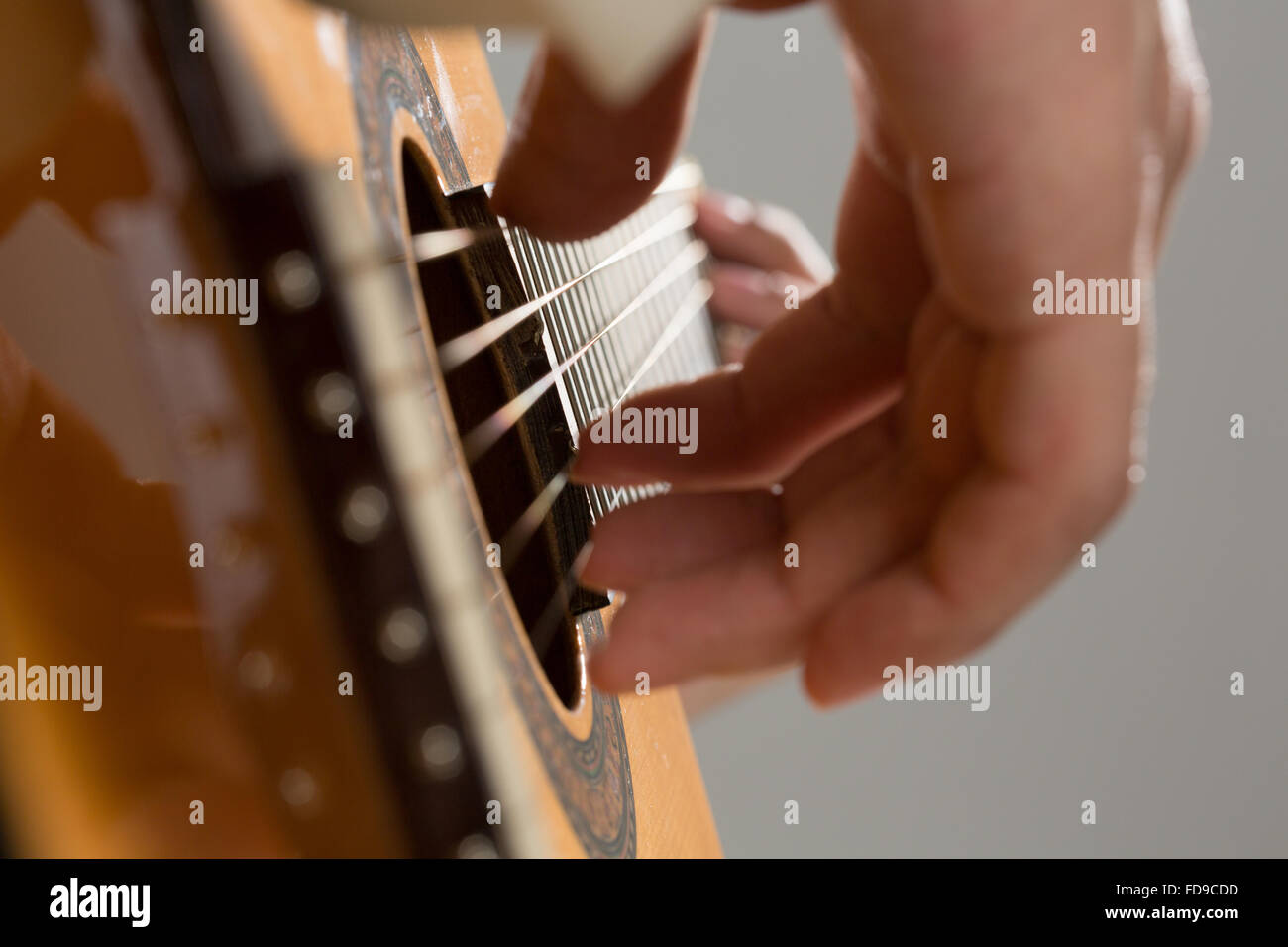 Close up of male hands playing acoustic guitar Stock Photo - Alamy