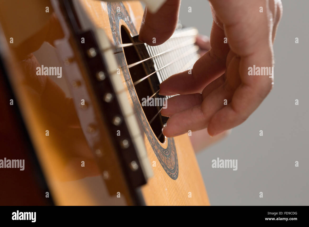 Close up of male hands playing acoustic guitar Stock Photo - Alamy