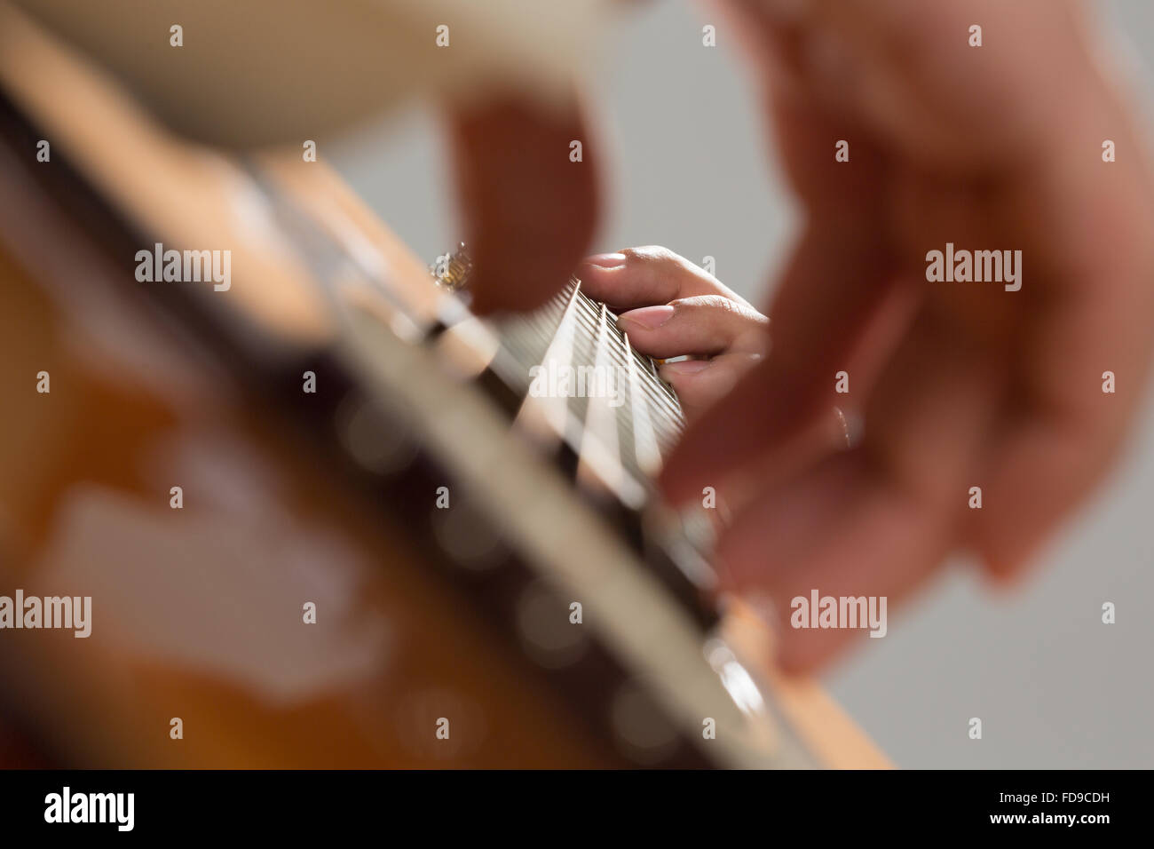 Close up of male hands playing acoustic guitar Stock Photo - Alamy