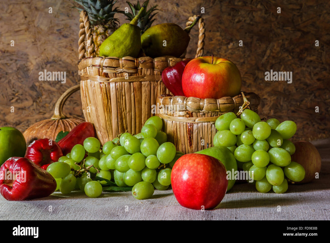 Still life with fruits placed in a basket made of natural materials ...
