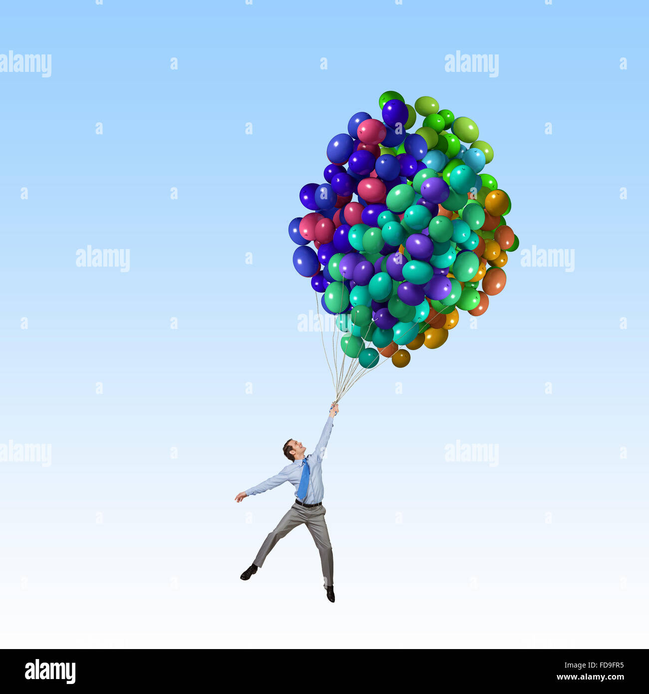 Young successful businessman flies on bunch of colorful balloons Stock ...