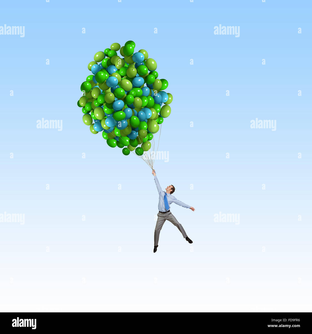 Young successful businessman flies on bunch of colorful balloons Stock ...