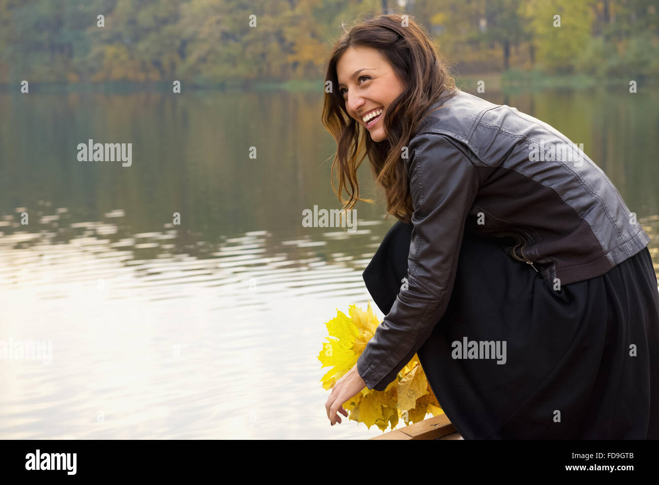 Autumn portrait of a beautiful cheerful woman Stock Photo - Alamy
