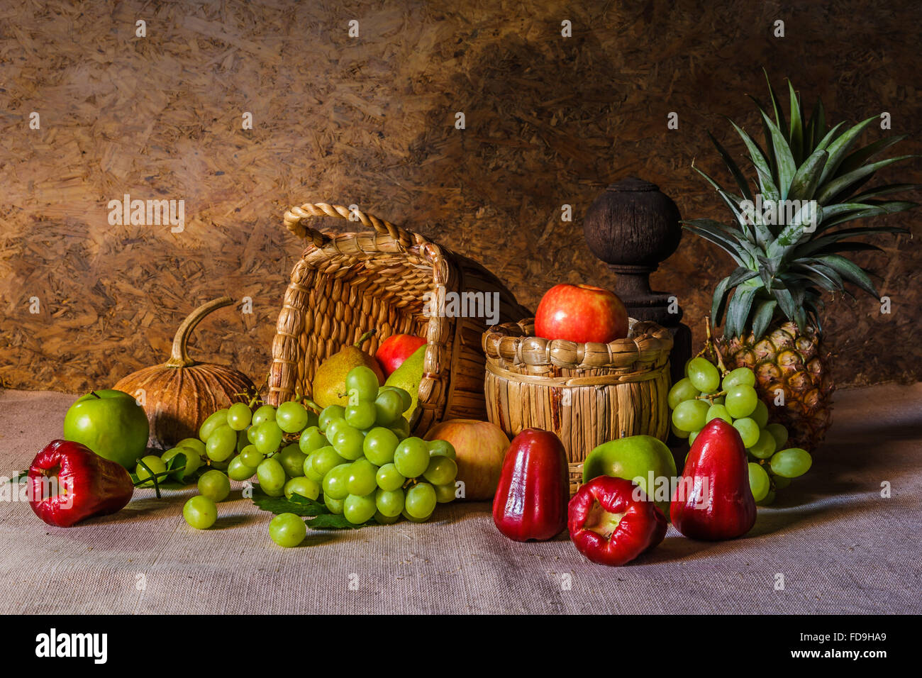 Still life with fruits placed in a basket made of natural materials ...